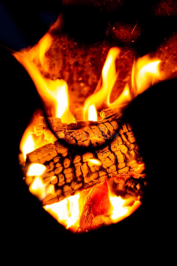Burning Wood and Open Flames Seen through the Cutout Part of a Metal ...