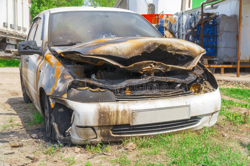 Burnt car on the street stock photo. Image of front - 154530200