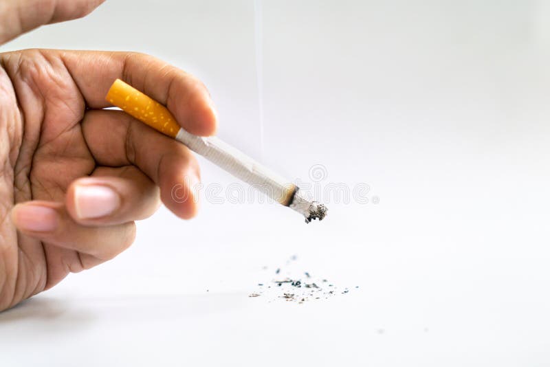Burnt Cigarette in hand stock photo. Image of addiction - 153011424