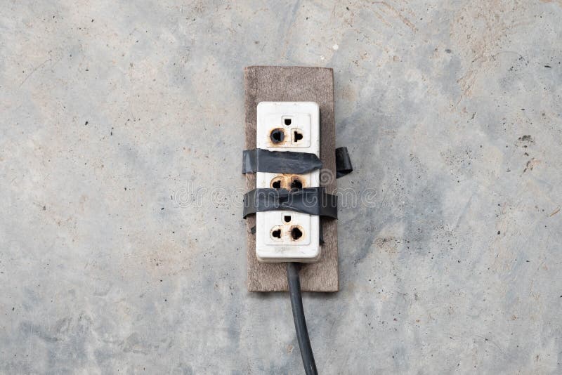 Burnt Electrical Socket and Plug, Poor Quality Product on the Cement ...