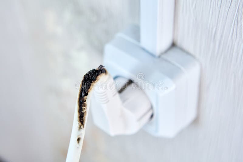 An Electrical Plug with Burnt Wire in Socket. Stock Image - Image of ...