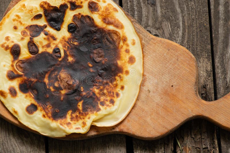 Burnt Fried Pancakes on a Blackboard on a Table in the Kitchen for ...