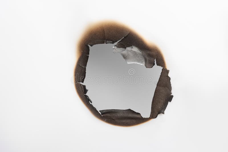 Burnt Hole in Paper on White Background Stock Photo - Image of ...