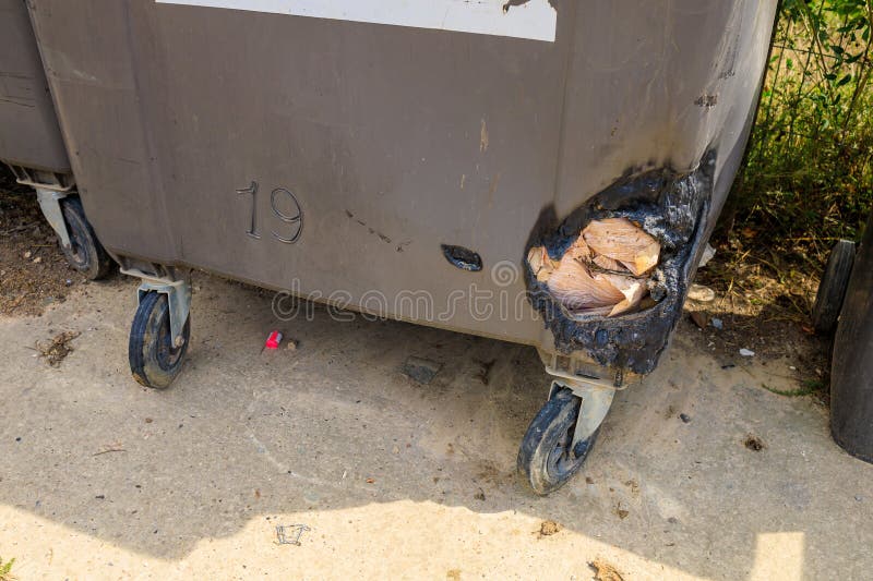 A Burnt Hole in a Plastic Trash Can or Bin. Background with Selective ...
