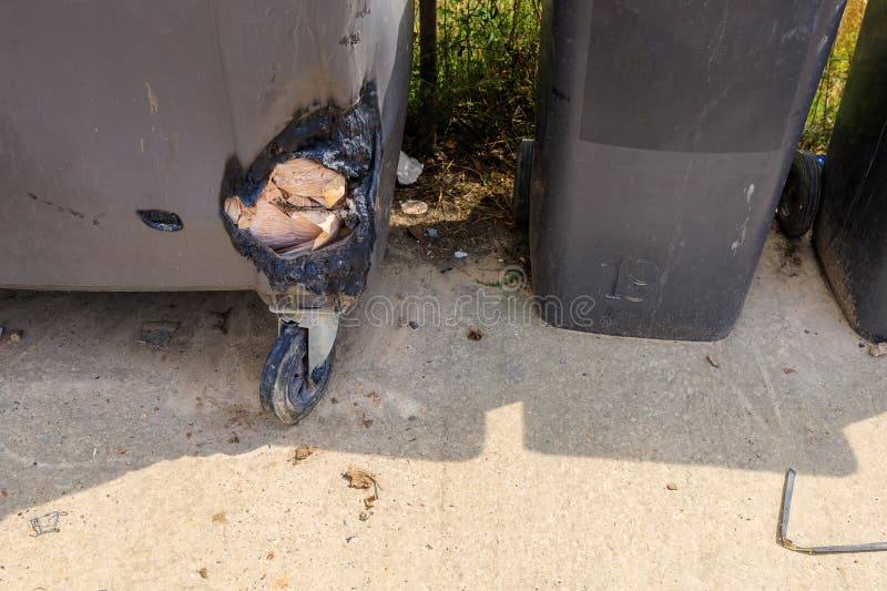 A Burnt Hole in a Plastic Trash Can or Bin. Background with Selective ...