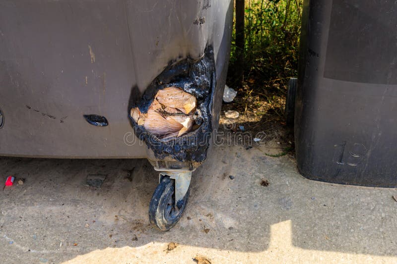 A Burnt Hole in a Plastic Trash Can or Bin. Background with Selective ...