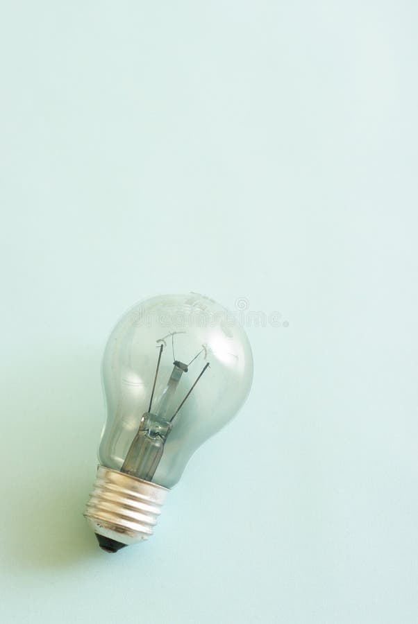 Burnt Light Bulb on Blue Background Stock Photo - Image of glowing ...