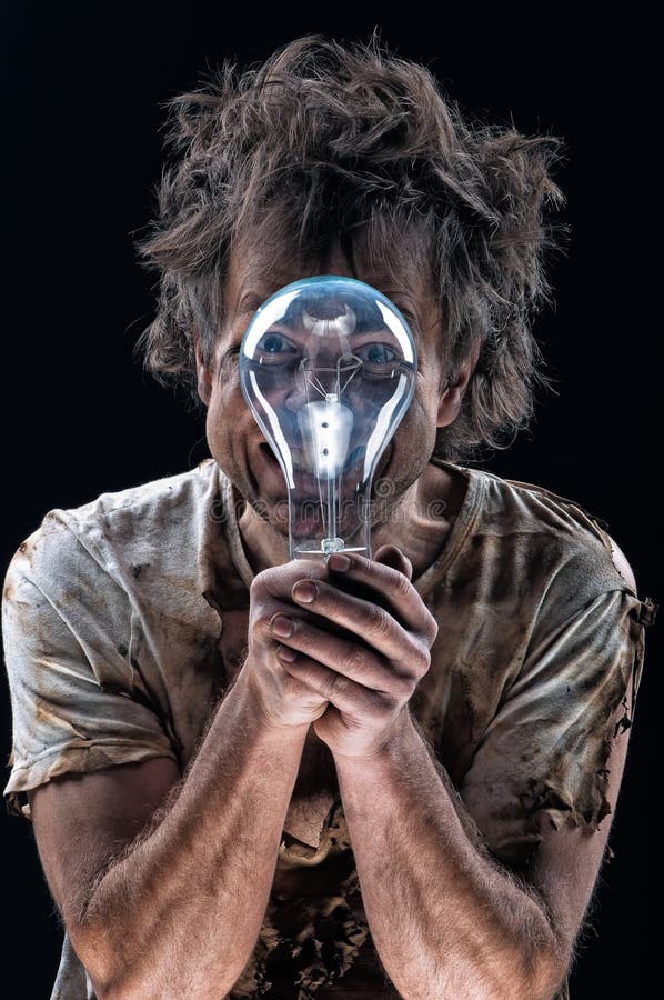 Burnt man with light bulb stock image. Image of cord - 79762165