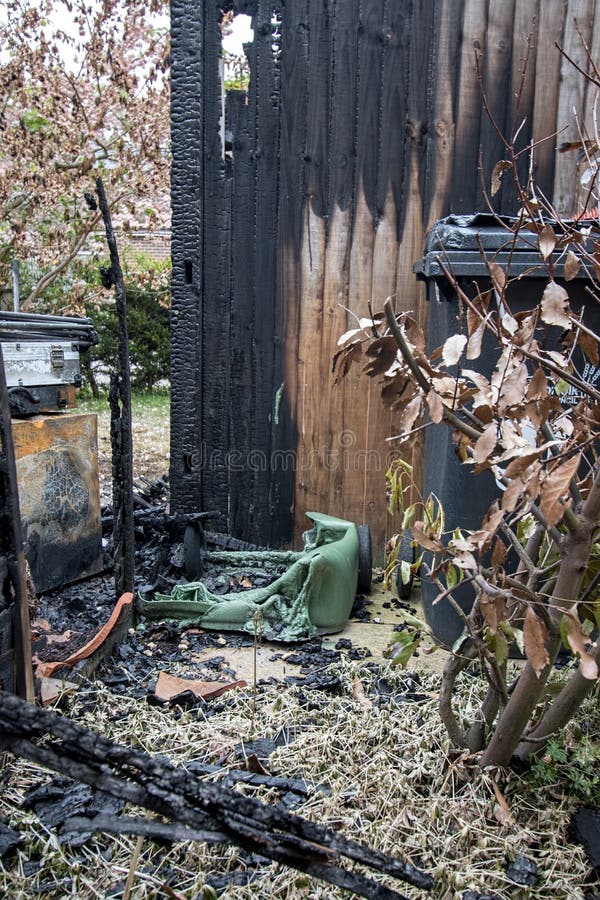 Burnt and Melted Remains of Plastic Wheelie Bin Fire. Stock Photo ...