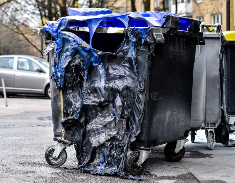 Burnt and Melted Trash Can Form a Fire. Stock Image - Image of ...