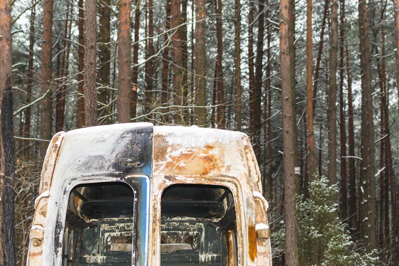A Burnt-out Minivan Stands Near the Forest in Winter Stock Photo ...