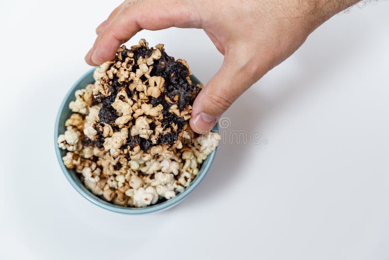 Burnt Black Popcorn in a Blue Cup Stock Image - Image of ingredient ...