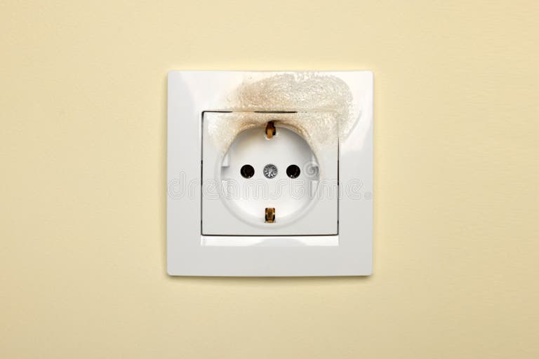 Burnt Power Socket on Beige Wall. Electrical Short Circuit Stock Photo ...