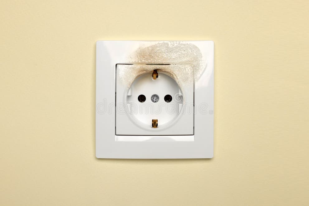Burnt Power Socket on Beige Wall. Electrical Short Circuit Stock Photo ...