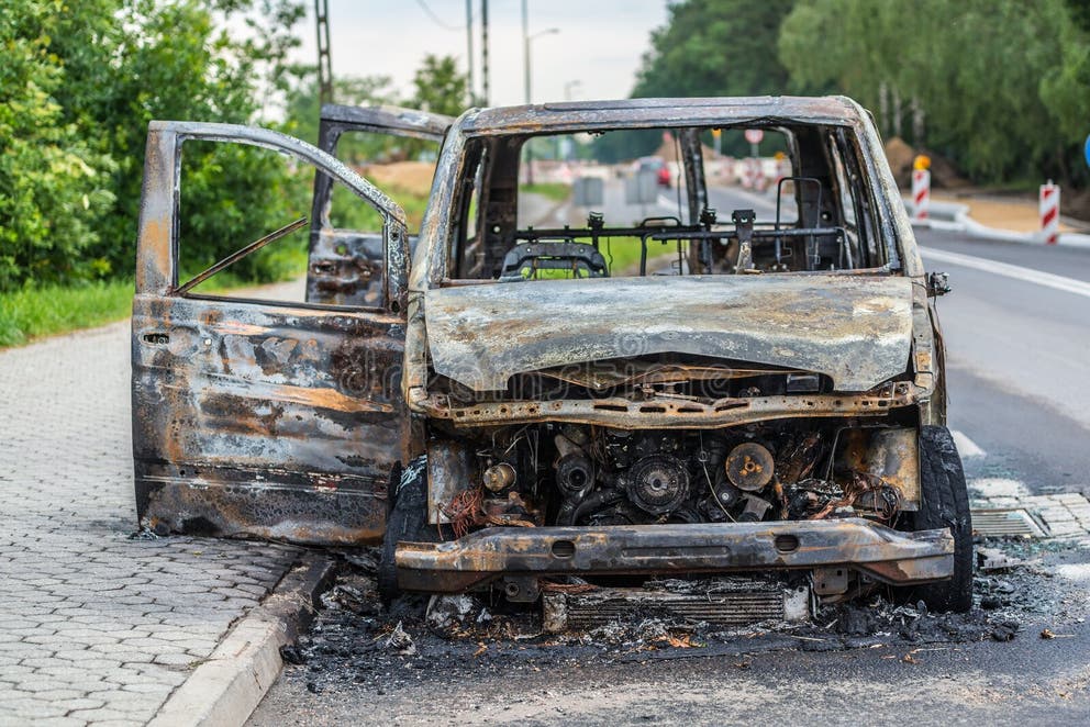 Burnt rusty car on road. stock image. Image of damage - 119958047