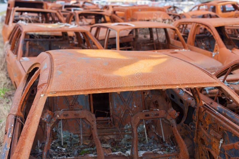 Burnt-out Rusty Cars on a City Street, Vandalism. Setting Fire To Cars ...