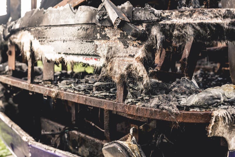 A Burnt and Totaled Bus Destroyed by Fire Abandoned at an Empty Lot ...