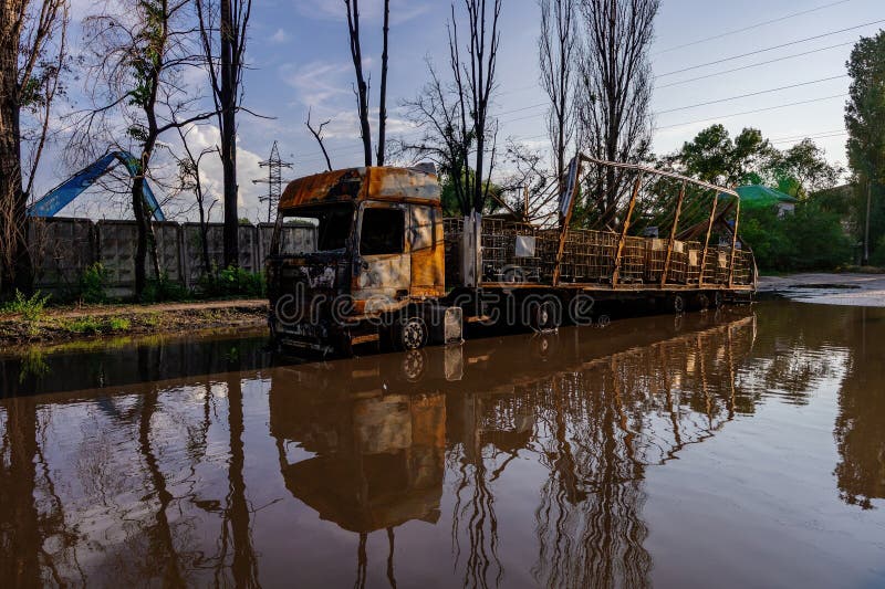 Burnt Truck on Flooded Road. Fire or Attack Aftermath Editorial Photography - Image of flood ...