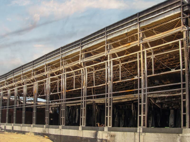 Burnt Warehouse Structure Post-fire, Showcasing Charred Metal Frames ...