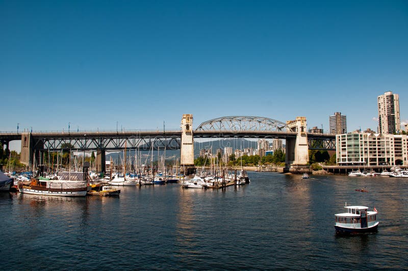 Burrard bridge and boats editorial stock photo. Image of water - 262716923
