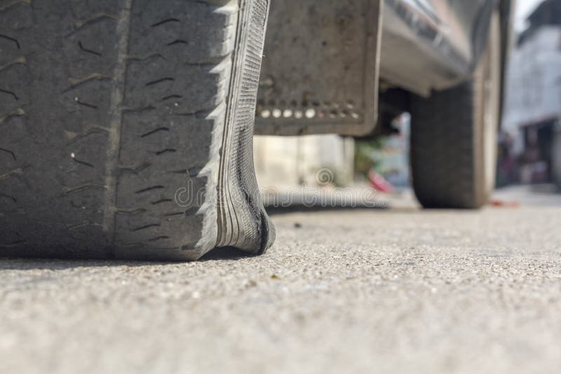 Burst car tire on street. stock photo. Image of blowout - 67238104