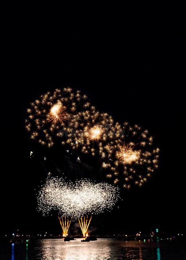 Burst of Colorful Firework Explosions Over a Harbor during the British ...