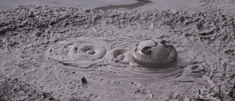 Bursting Mud Bubble in a Geothermal Pool in NZ Stock Photo - Image of ...