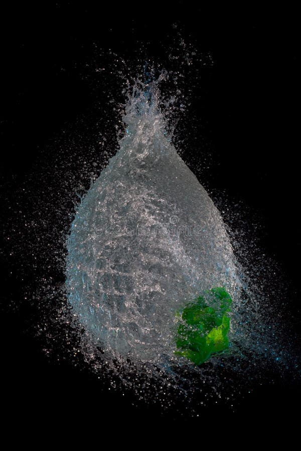 Bursting a water balloon stock image. Image of splash - 4852369