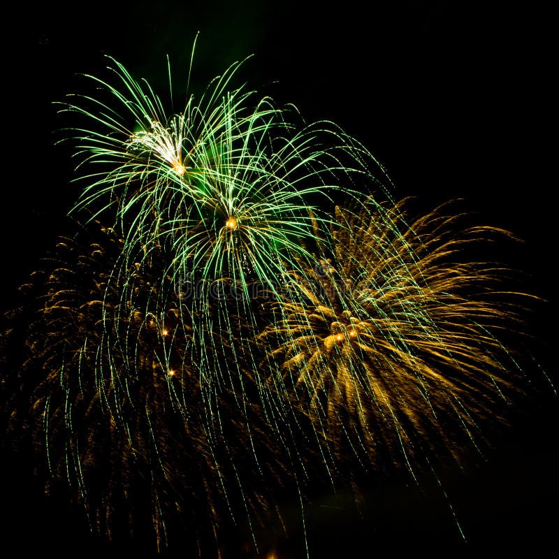 Bursts of Green and Gold Fireworks Stock Image - Image of celebrate ...