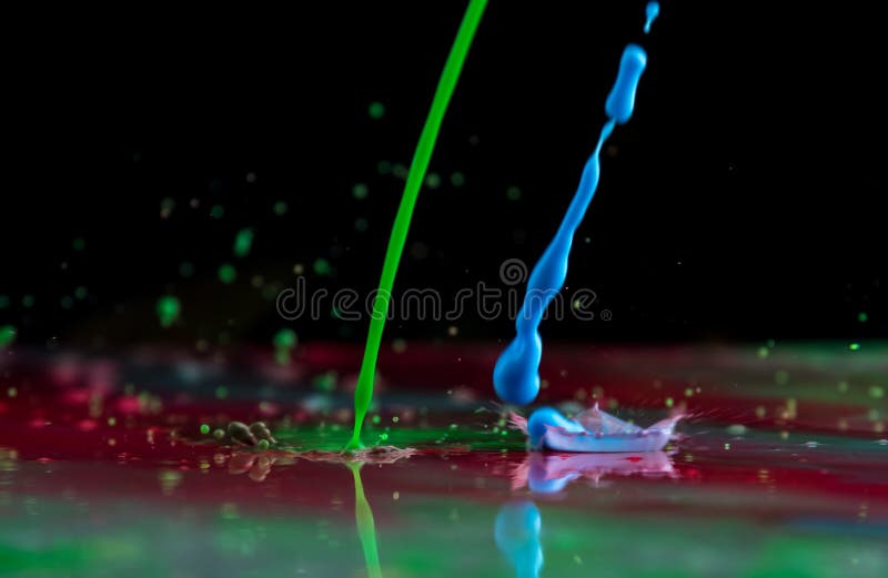 Bursts and Splashes from Falling Paints of Different Colors Stock Image ...
