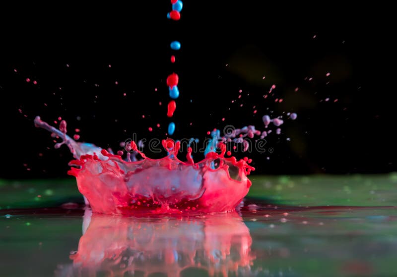 Bursts and Splashes from Falling Paints of Different Colors Stock Photo ...