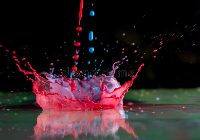 Bursts and Splashes from Falling Paints of Different Colors Stock Photo ...