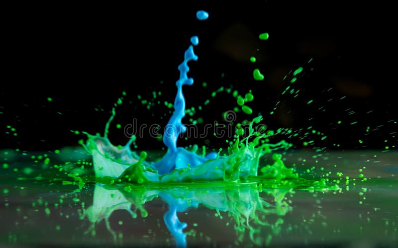 Bursts and Splashes from Falling Paints of Different Colors Stock Photo ...
