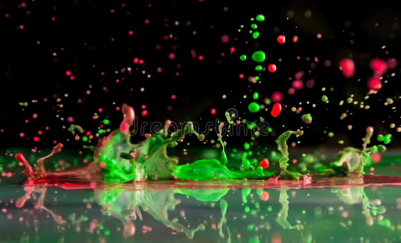 Bursts and Splashes from Falling Paints of Different Colors Stock Photo ...