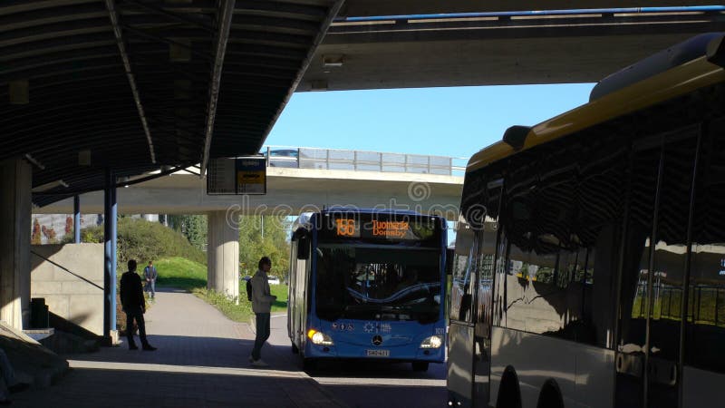 The Bus Arrives at the Bus Stop and the Passengers Boarding. Stock ...