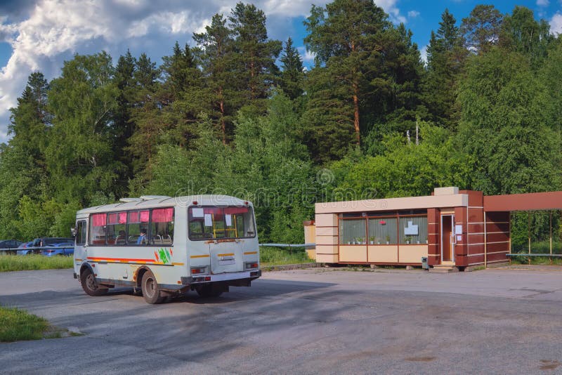 A Bus Awaits Passengers at a Stop in a Small Town Editorial Photography ...