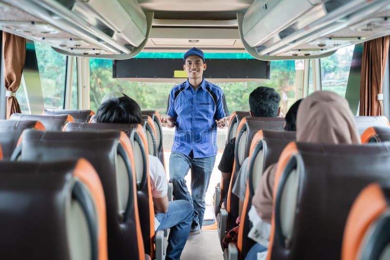 A Bus Crew in Uniform and a Hat Briefs the Passengers Stock Image ...