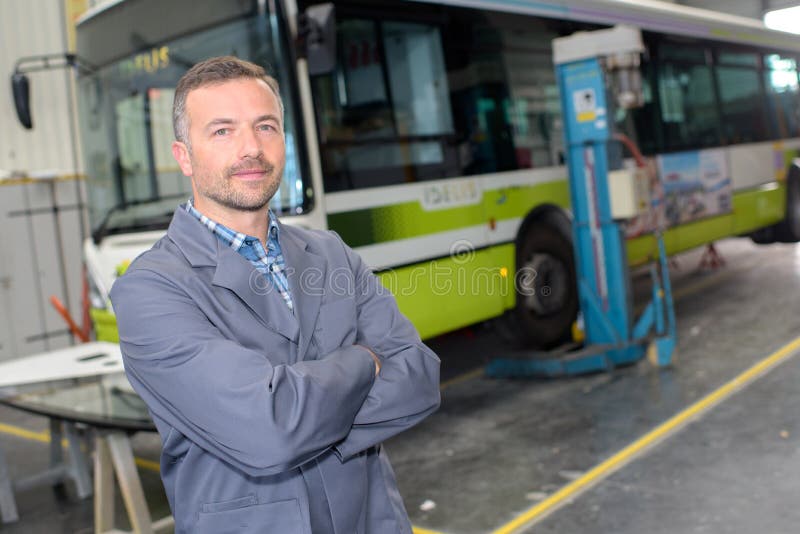 Bus mechanic posing stock photo. Image of passenger - 196684354