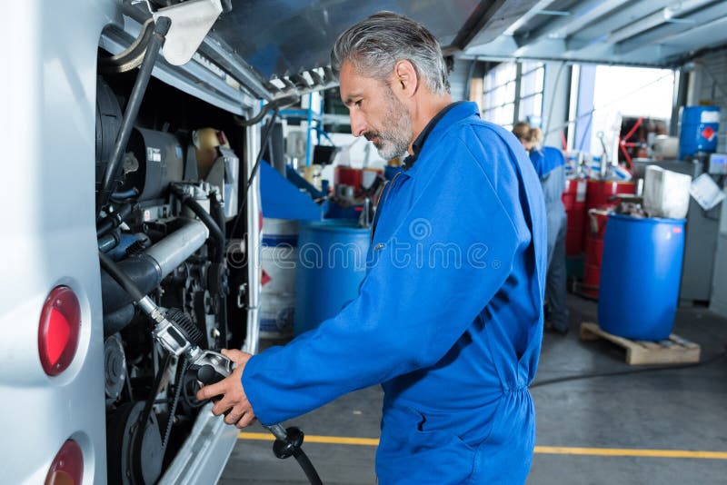 Bus mechanic at work stock photo. Image of repair, detail - 265787448