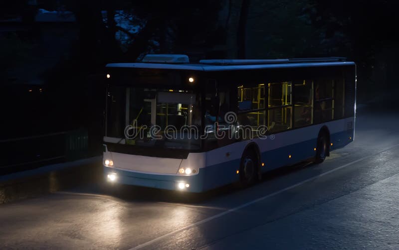 Bus moves on a night road stock photo. Image of background - 175821028