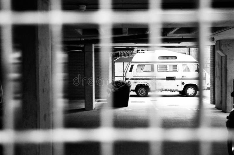 Bus Parked Inside a Building with a Fence in the Foreground Stock Photo ...