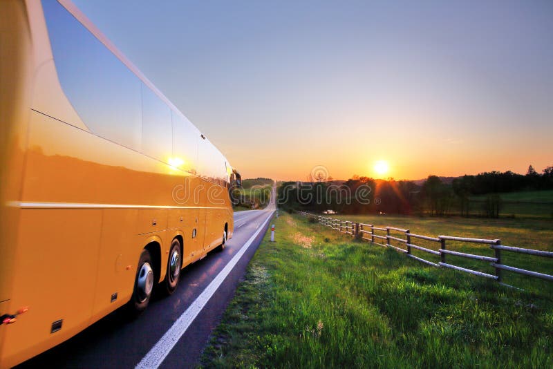 Bus on the road at sunset stock image. Image of driver - 120220083