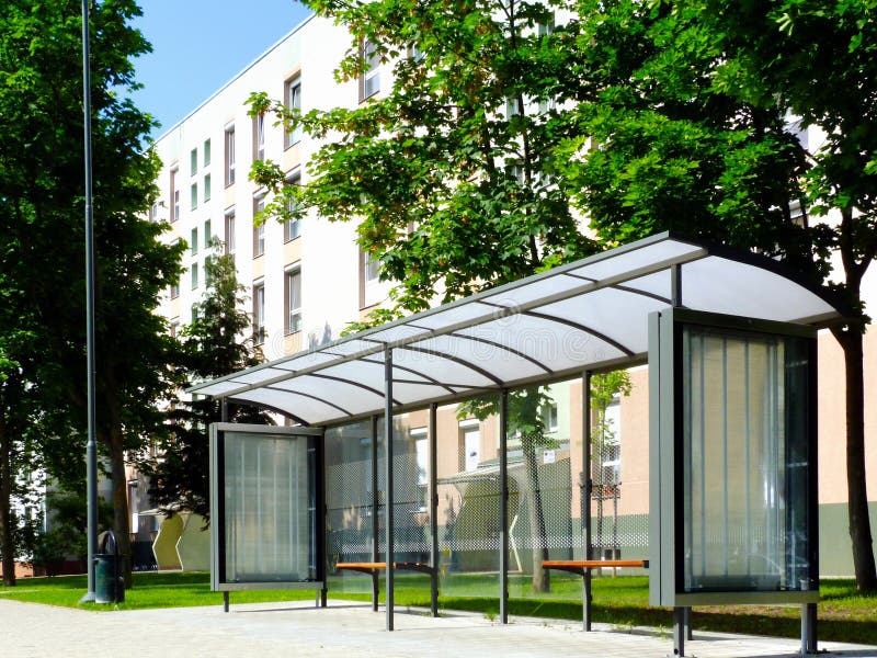 Bus Shelter of Clear Glass Design in Residential Area. Park Like ...