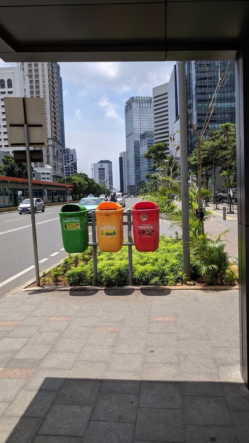 Bus Stop with Colored Garbage Can Pedestrian Editorial Photography ...