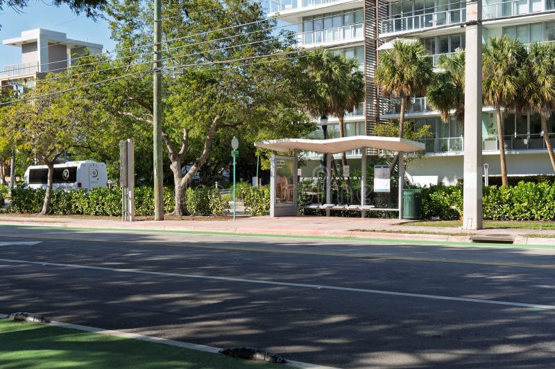 Bus stop on a Miami street editorial photo. Image of skyline - 357472306