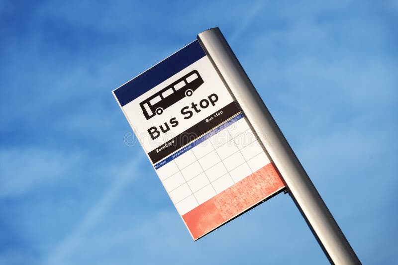 Bus Stop Sign on Post Against Blue Sky Stock Image - Image of sign ...