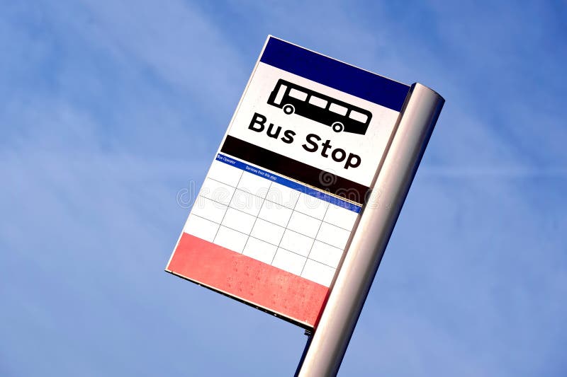 Bus Stop Sign on Post Against Blue Sky Stock Photo - Image of help ...