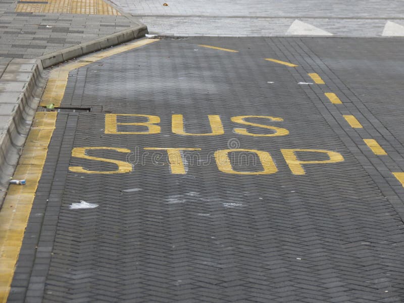 Bus stop yellow writing stock photo. Image of travelling - 83341440