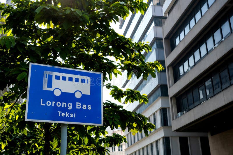 A Bus and Taxi Lane Sign in Urban Setting Stock Photo - Image of modern ...