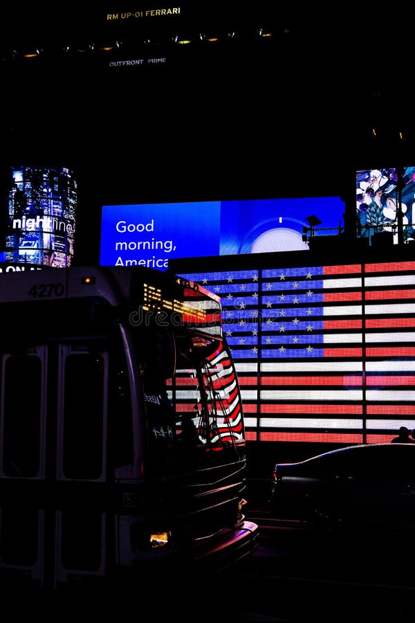 Bus at Times Square with an American Flag Reflected on Its Windshield ...